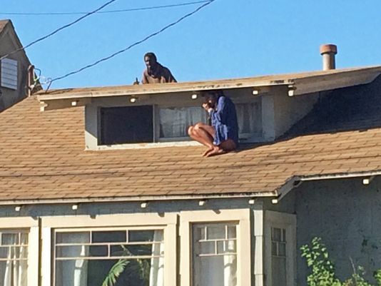Woman's dramatic rooftop escape caught on camera | wcnc.com